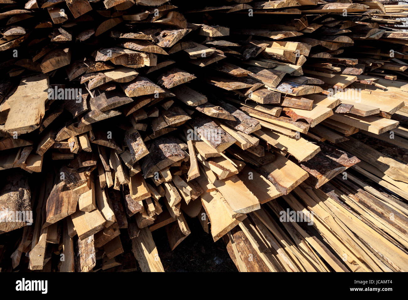 Pile of raw planks of pine wood Stock Photo - Alamy