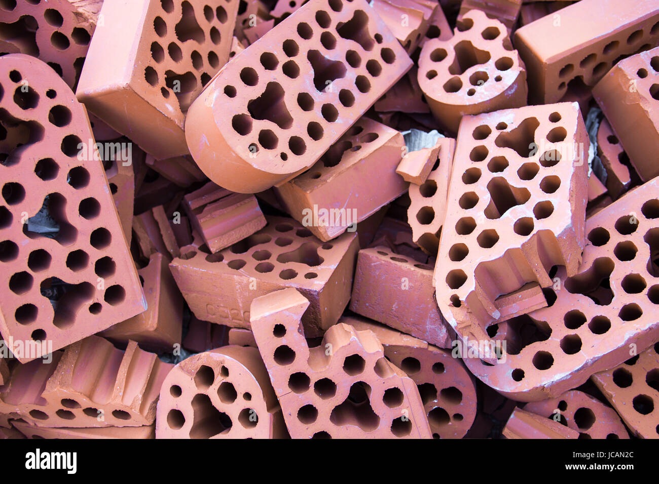 Pile of new intact and beaten silicate bricks Stock Photo - Alamy