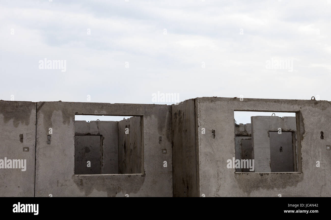 Unfinished grey concrete building in the construction site Stock Photo ...