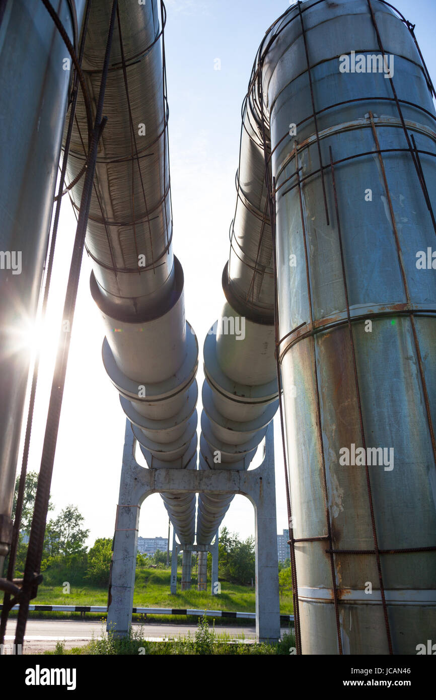 Elevated section of the pipelines above the road Stock Photo - Alamy