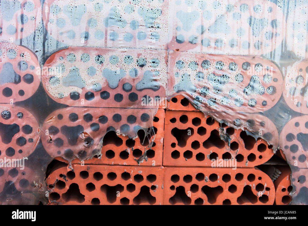 Stack of new silicate bricks with rounded edges in misted torn ...