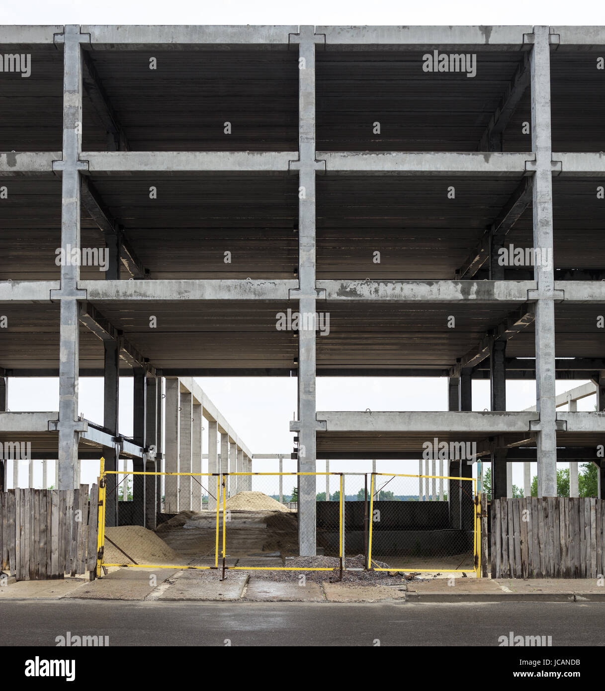 Unfinished grey concrete framework of the future building in the ...