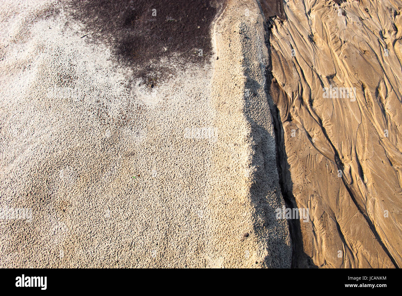Sand surface after the rain with the visible traces of the raindrops ...