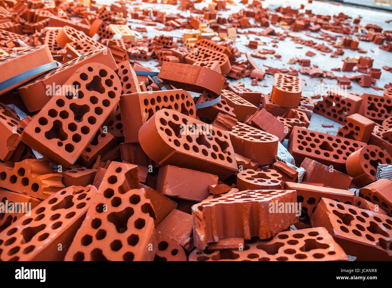 Pile of new intact and beaten silicate bricks Stock Photo - Alamy