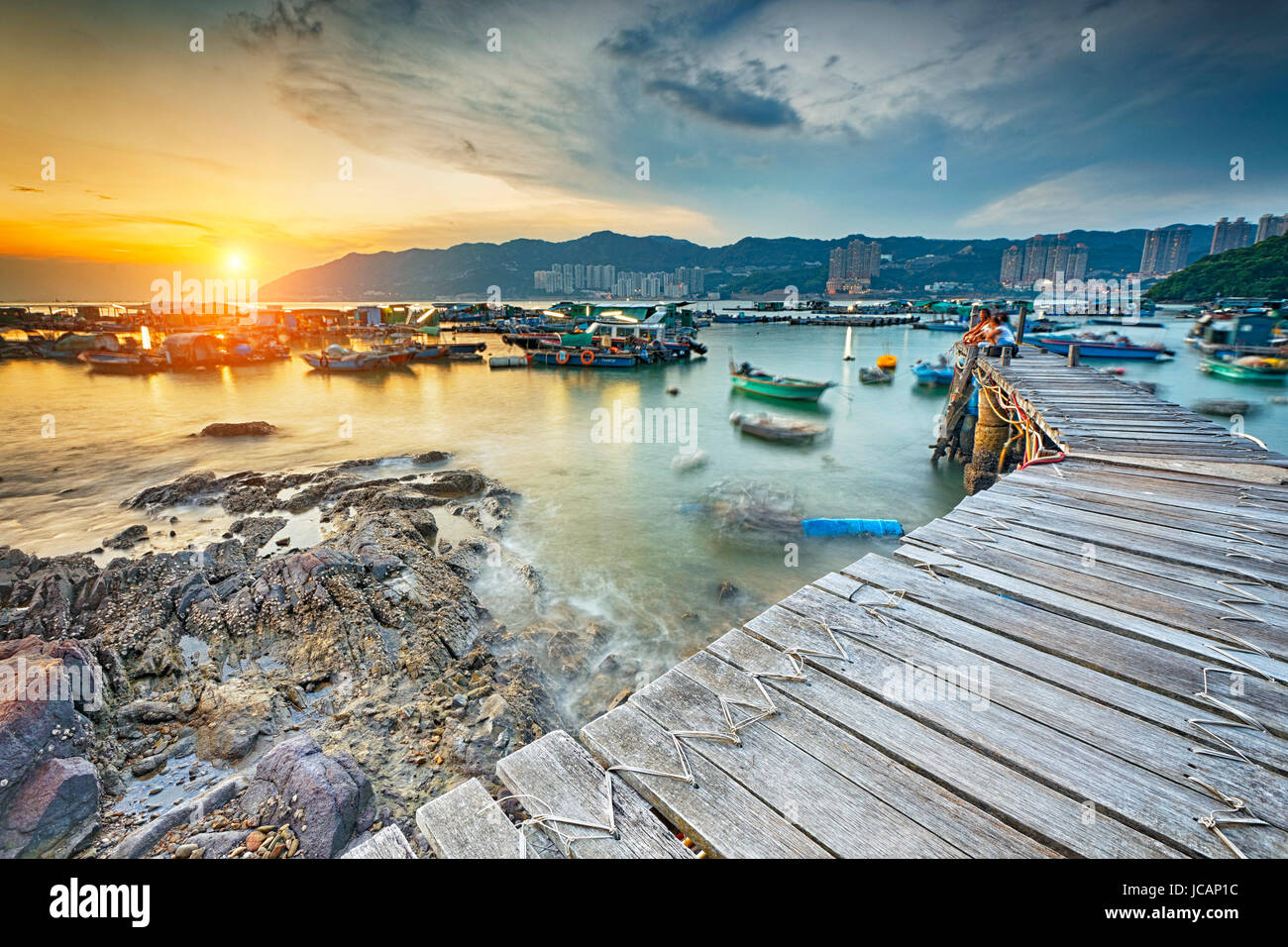 Boat pier at sunset. Beautiful landscape Stock Photo - Alamy