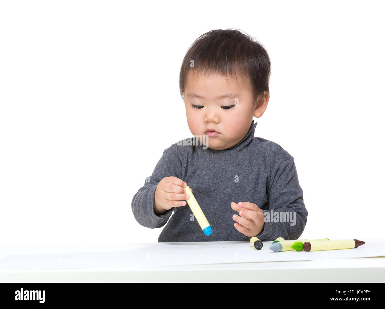 Little boy concentrate on drawing Stock Photo - Alamy