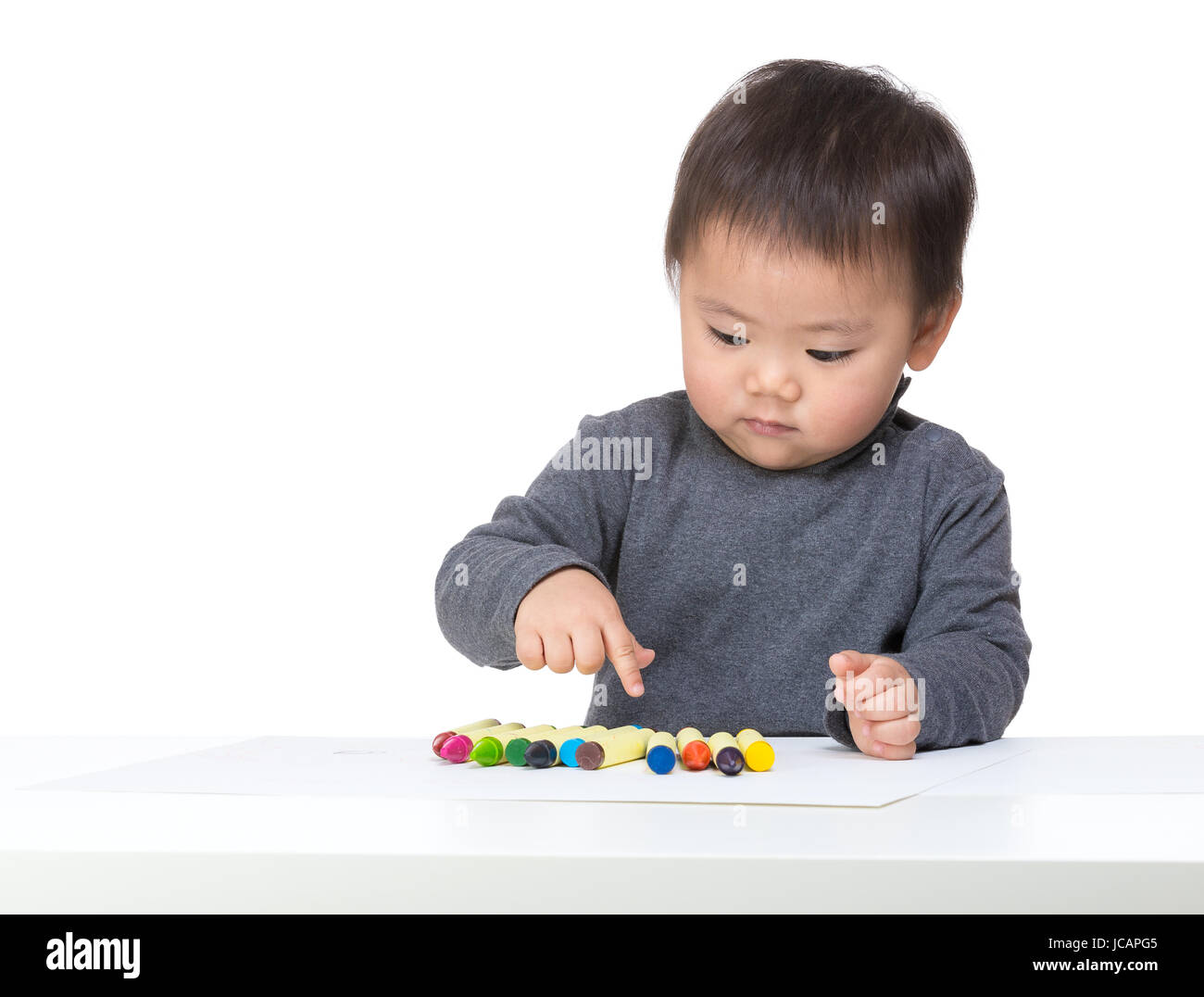 Little boy choosing color Stock Photo - Alamy