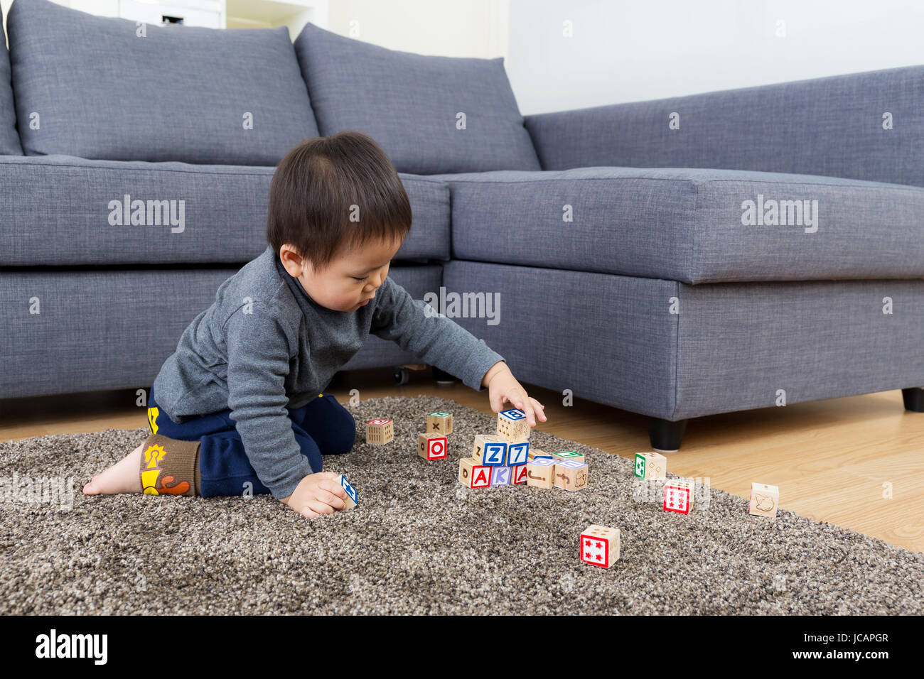 Asia baby boy play toy block at home Stock Photo - Alamy