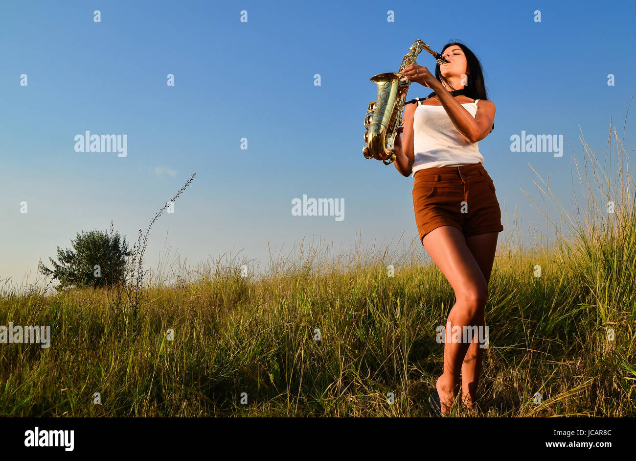 Woman with saxophone hi-res stock photography and images - Alamy