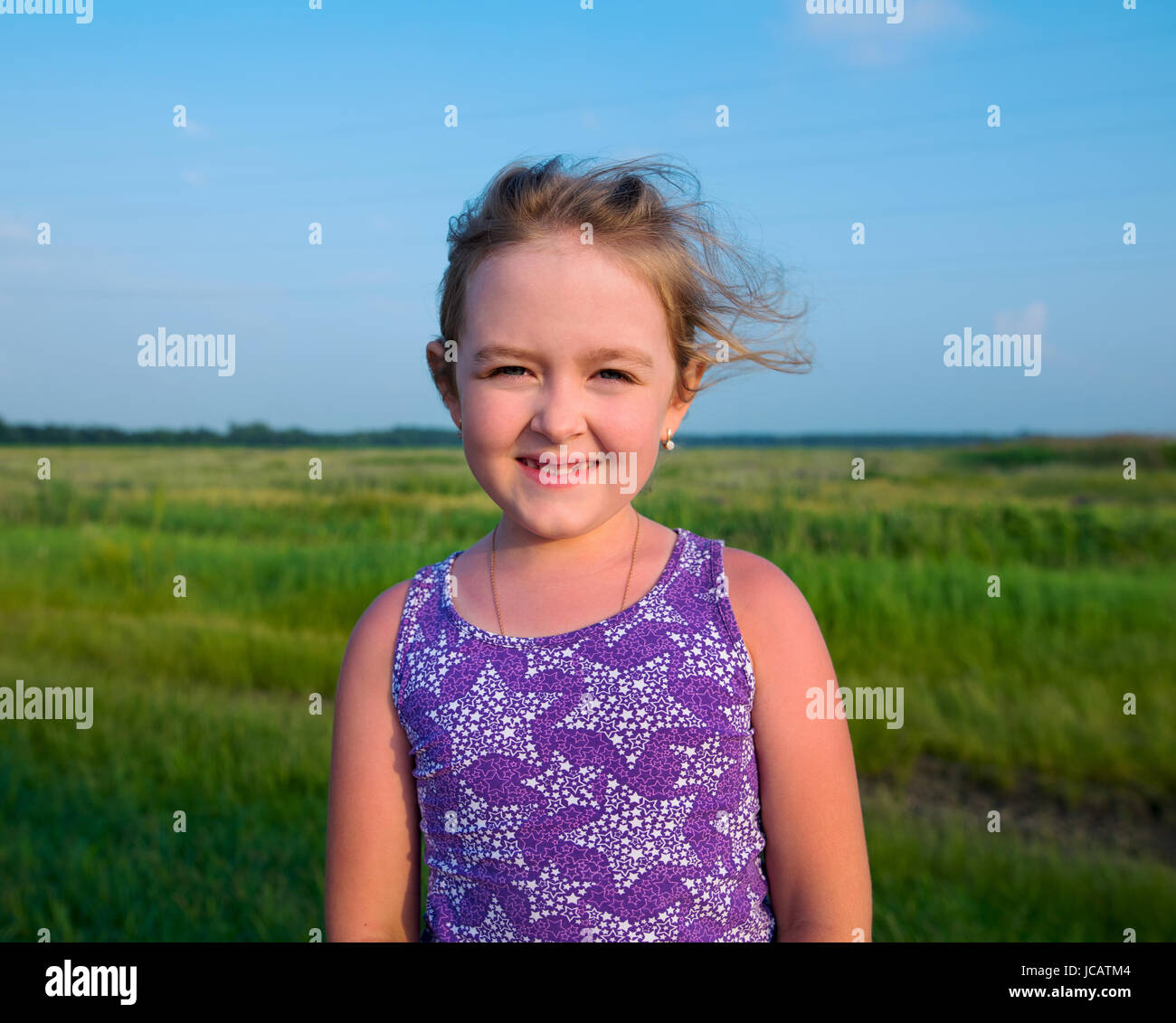 girl on the spring meadow Stock Photo - Alamy