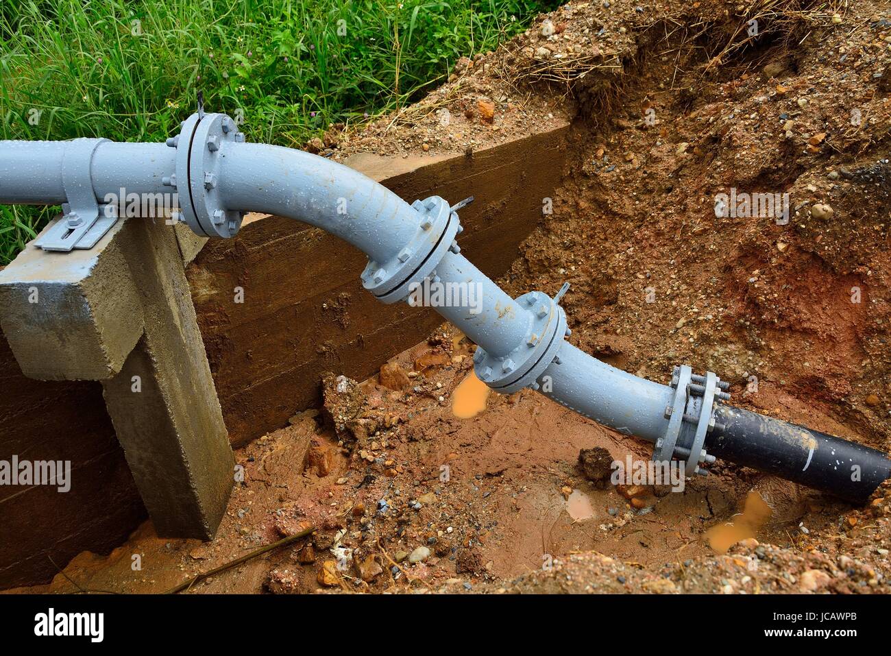 Connection plumbing to underground in rural Stock Photo - Alamy