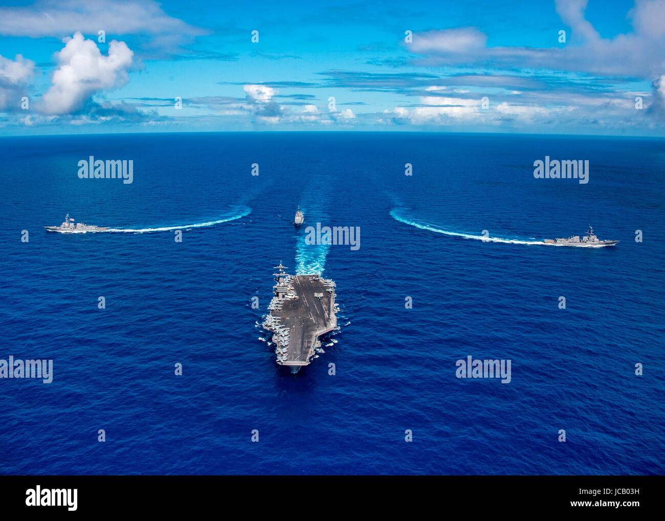 The U.S. Navy Nimitz-class aircraft carrier USS Carl Vinson escorted by ...