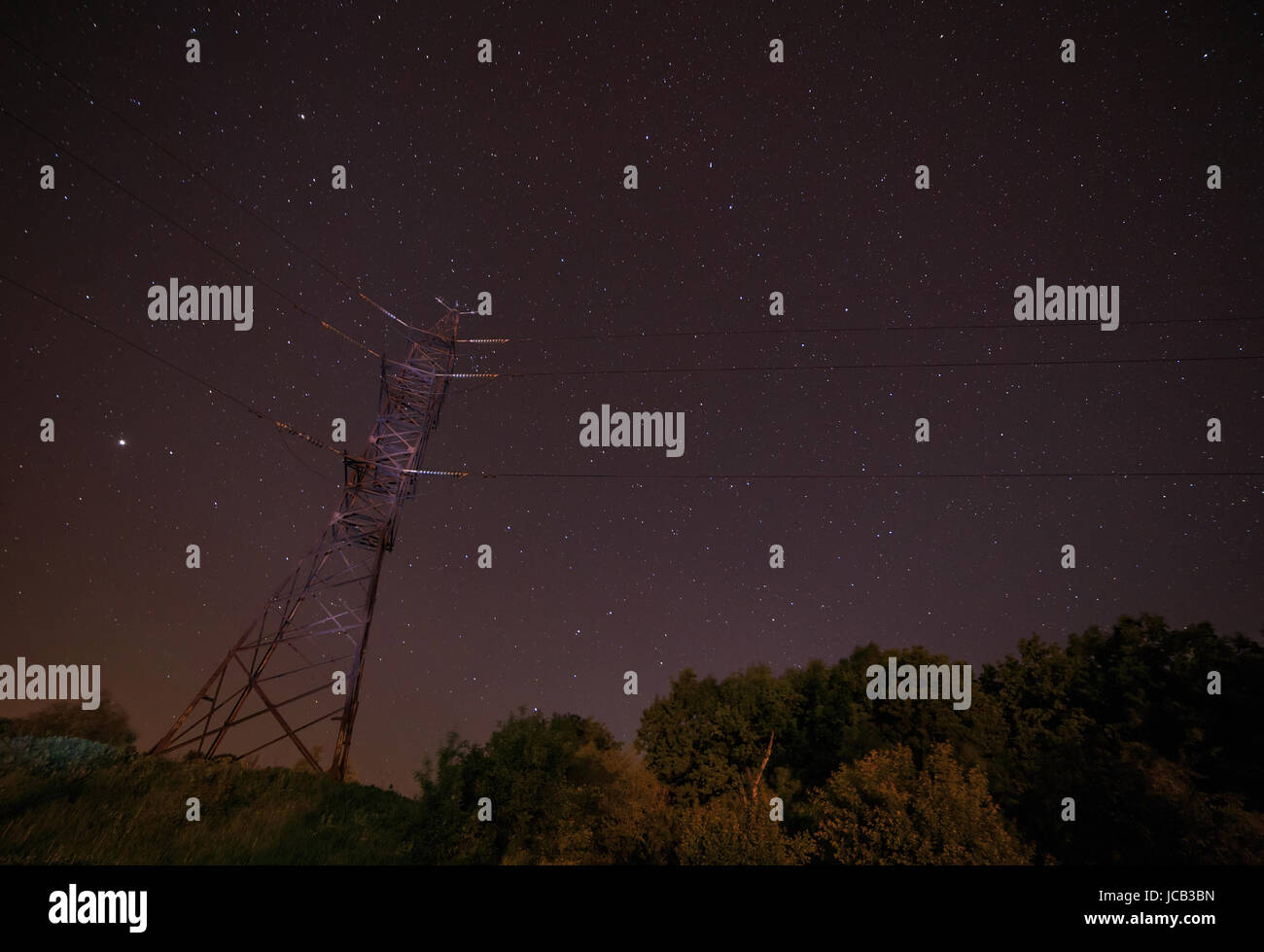 landscape with electricity pylon against starry sky Stock Photo - Alamy