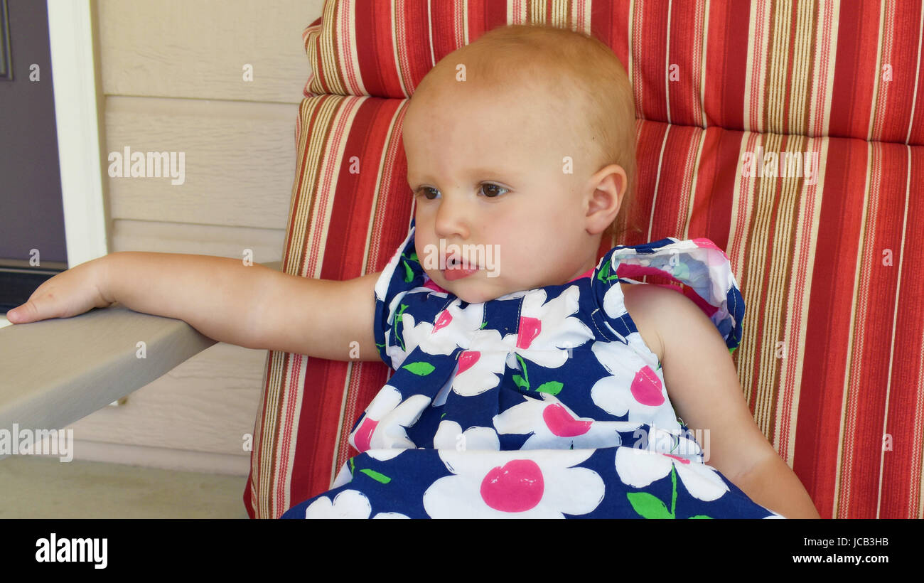 Toddler relaxing from summer playtime Stock Photo - Alamy