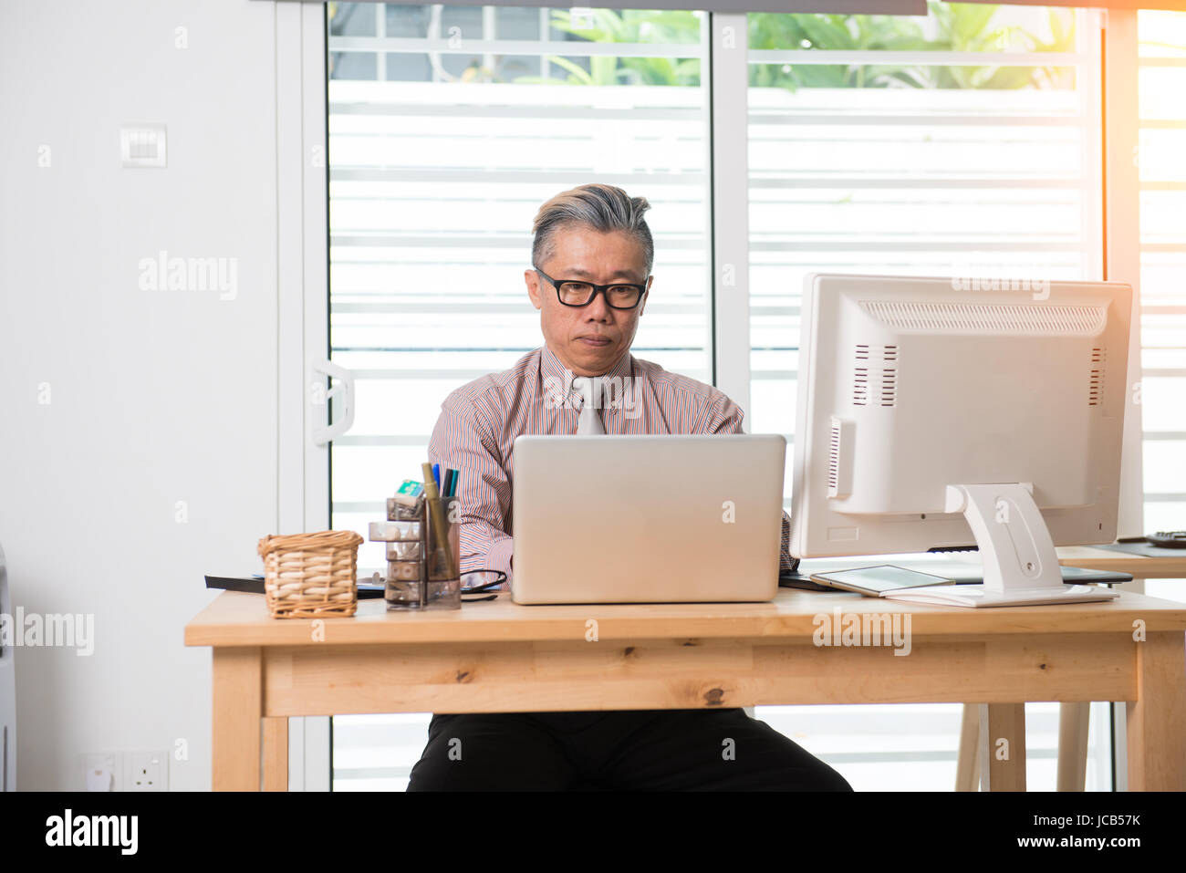 senior asian male at work Stock Photo - Alamy