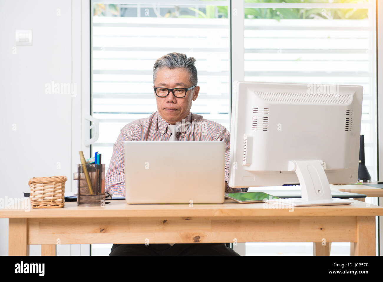 senior asian male at work Stock Photo - Alamy
