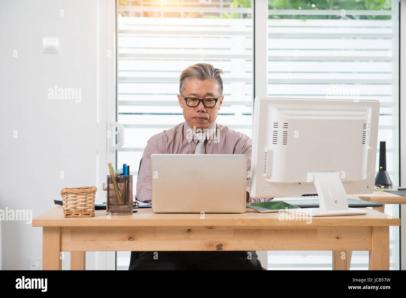 senior asian male at work Stock Photo - Alamy