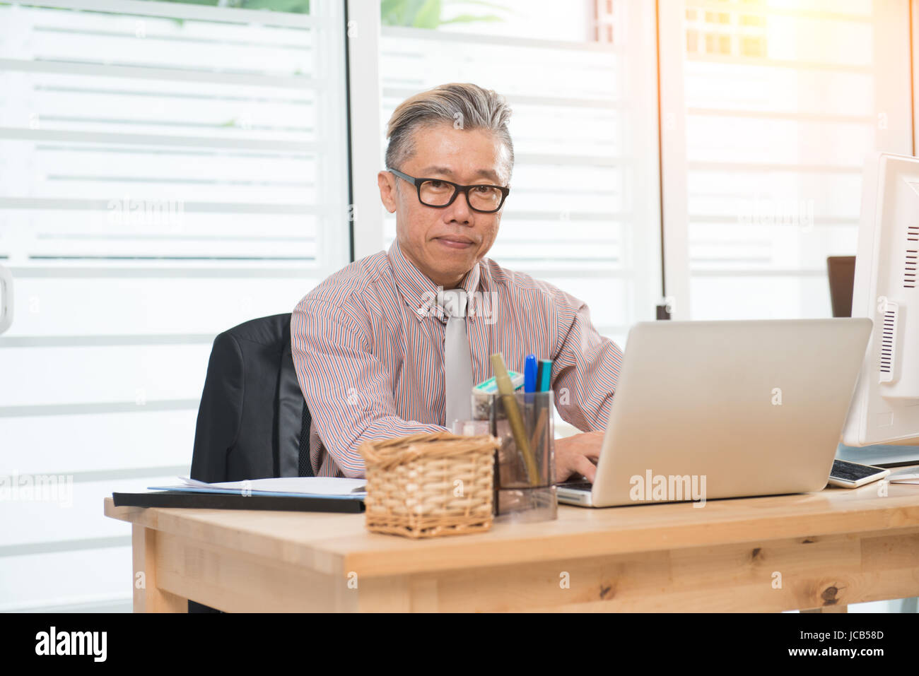 senior asian male at work Stock Photo - Alamy