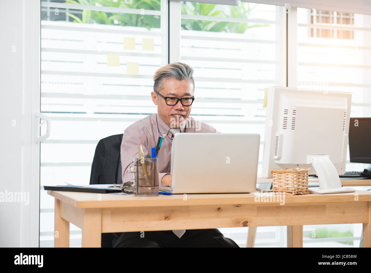 senior asian male at work Stock Photo - Alamy