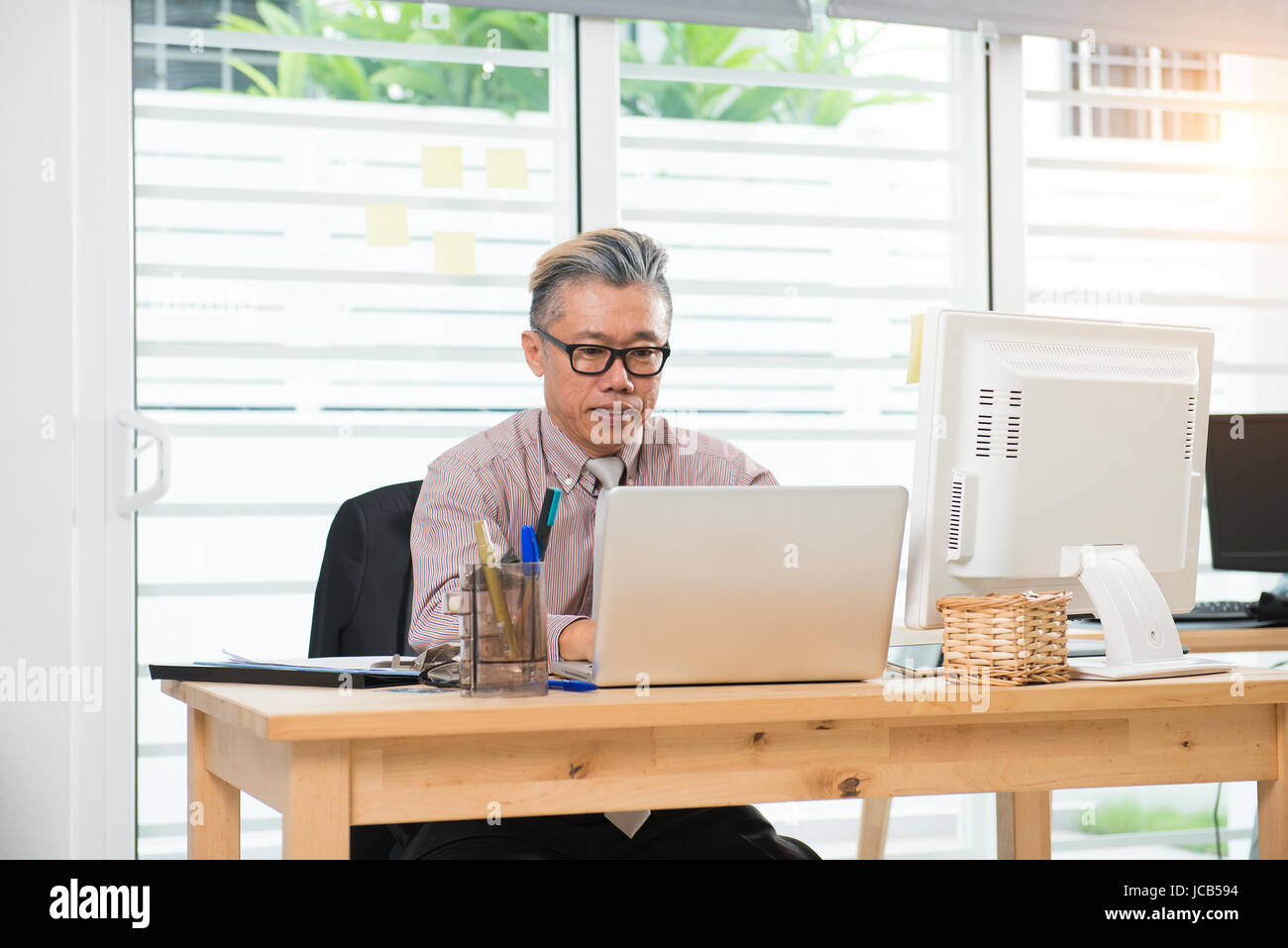 senior asian male at work Stock Photo - Alamy