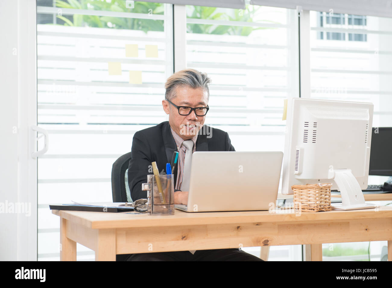 senior asian male at work Stock Photo - Alamy