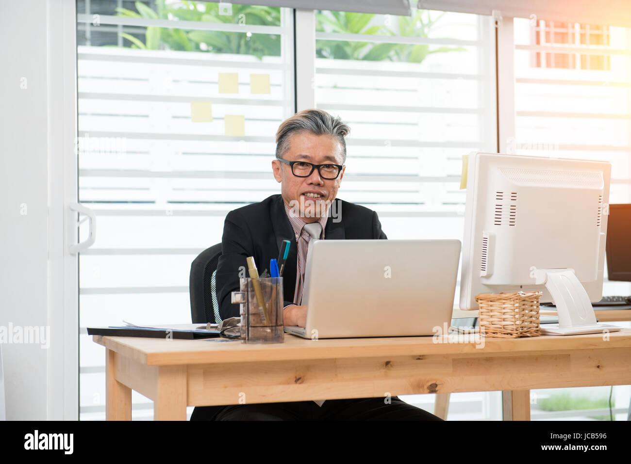 senior asian male at work Stock Photo - Alamy