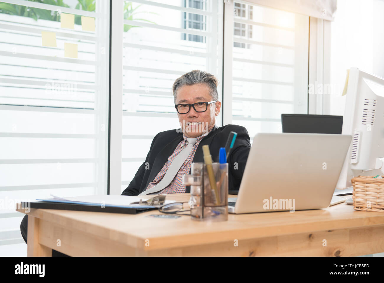 senior asian male at work Stock Photo - Alamy