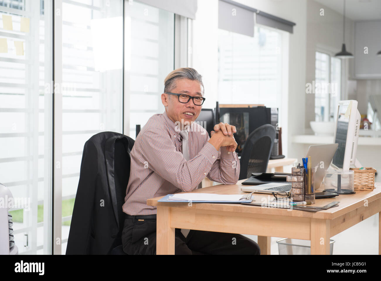 senior asian male at work Stock Photo - Alamy