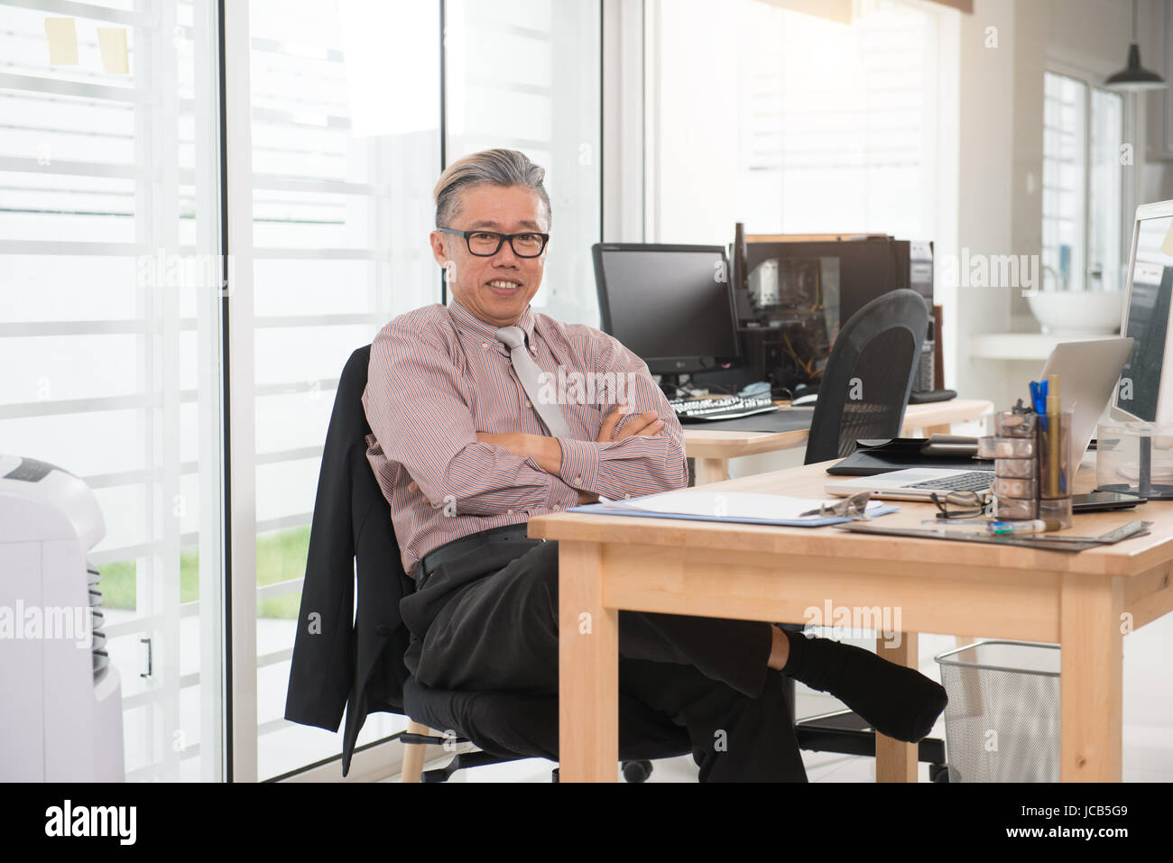 senior asian male at work Stock Photo - Alamy