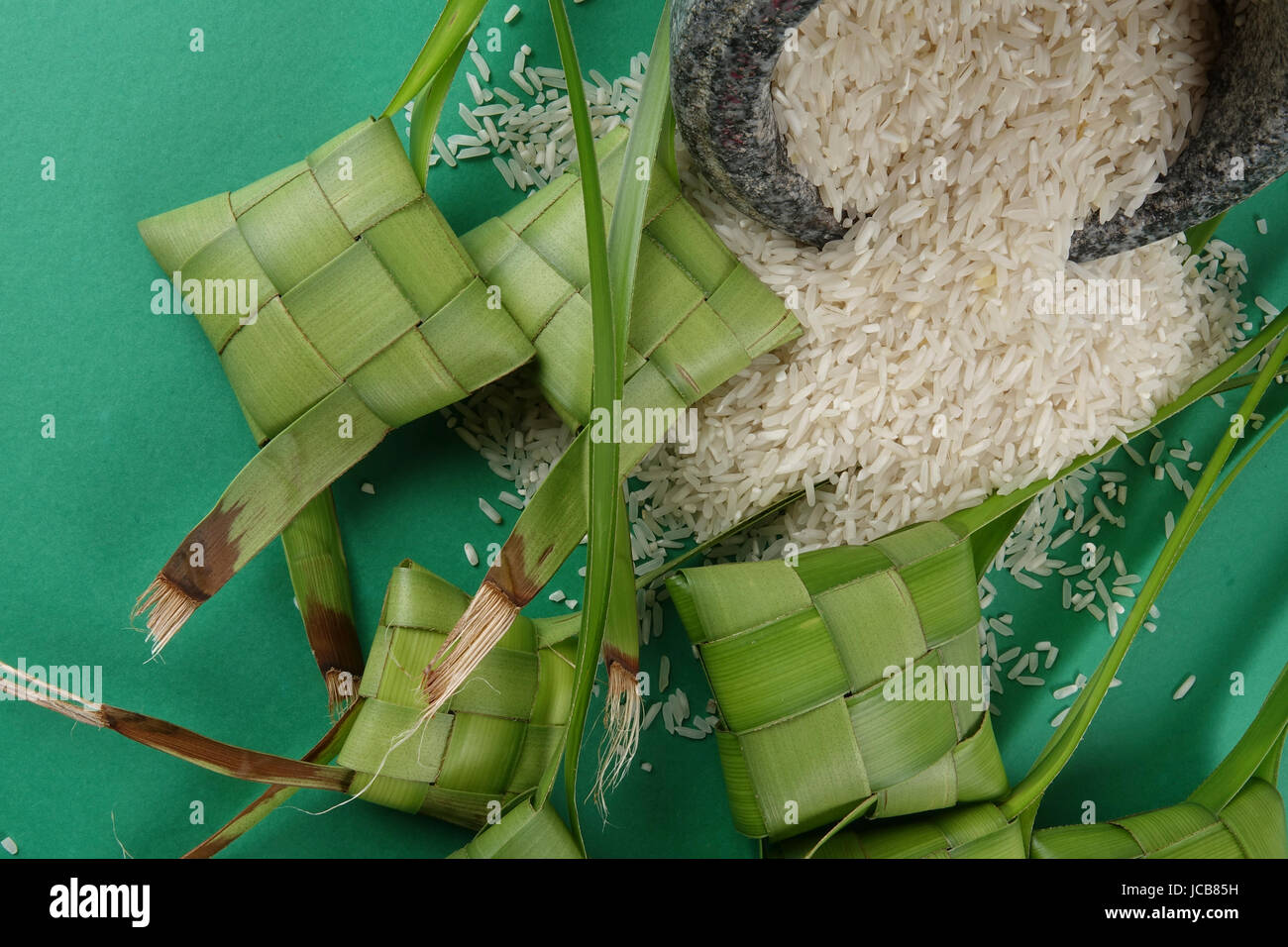 Rice dumpling on green background Stock Photo - Alamy