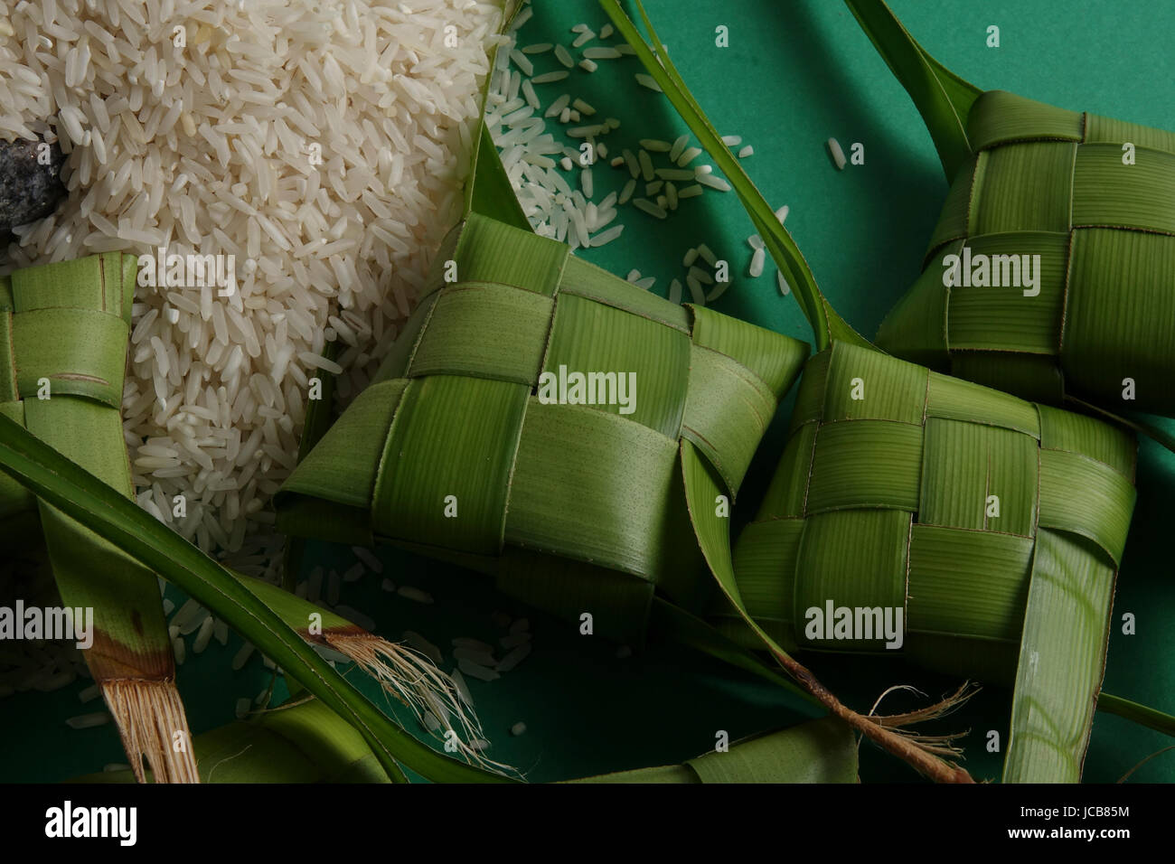 Rice dumpling on green background Stock Photo - Alamy