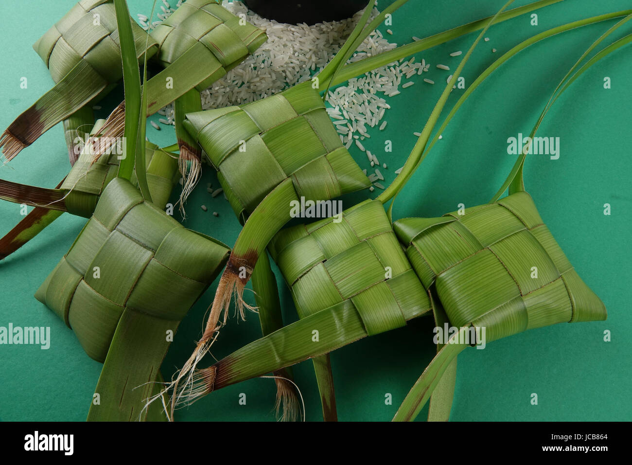 Rice dumpling on green background Stock Photo - Alamy