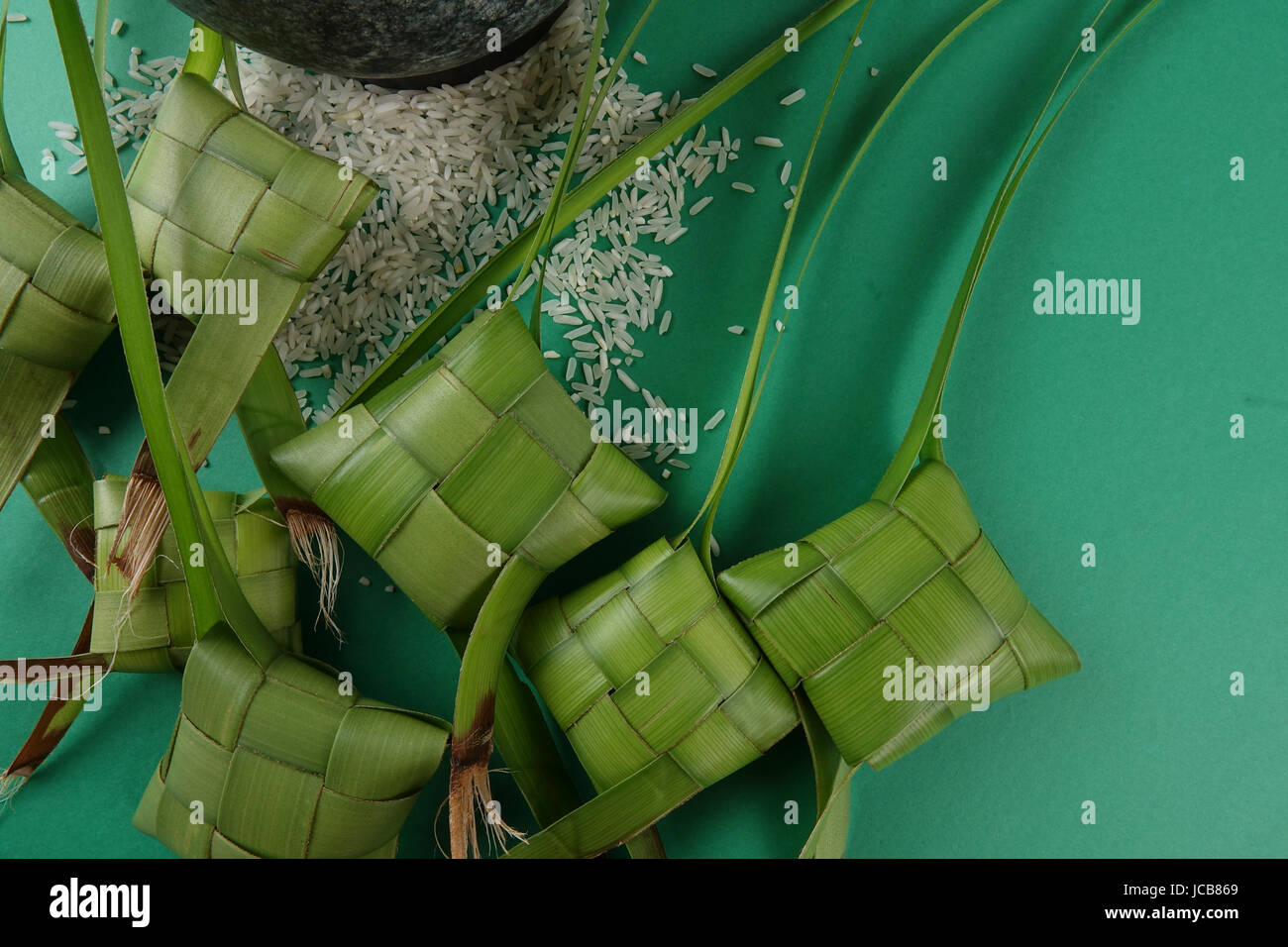 Rice dumpling on green background Stock Photo - Alamy