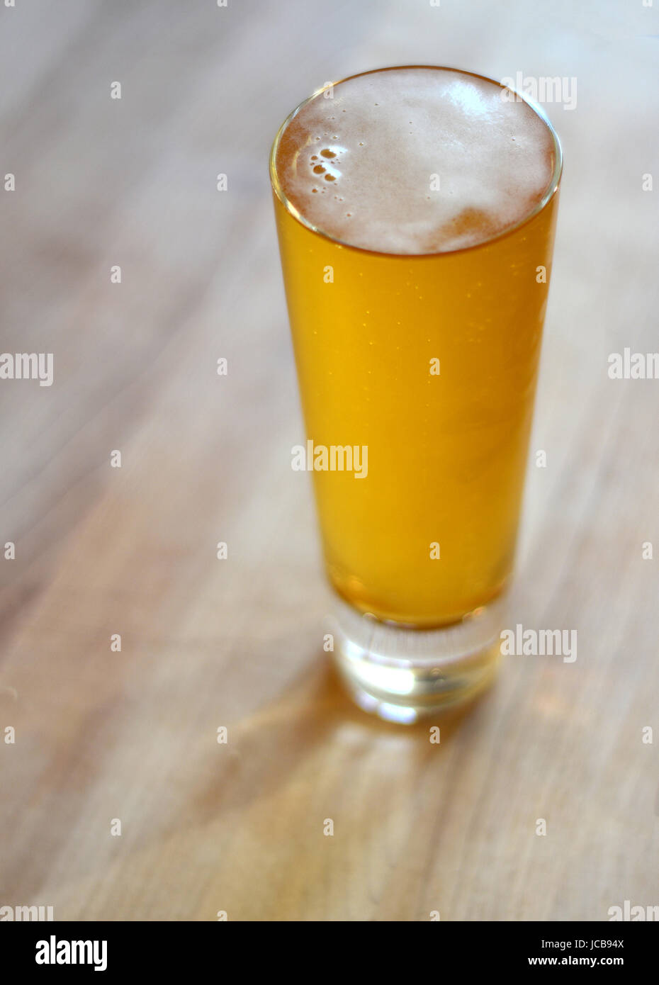 Beer in a pint glass Stock Photo - Alamy