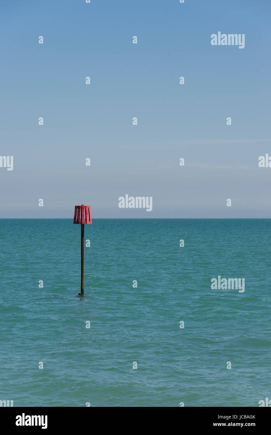 red navigation mark on a post in the sea Stock Photo - Alamy