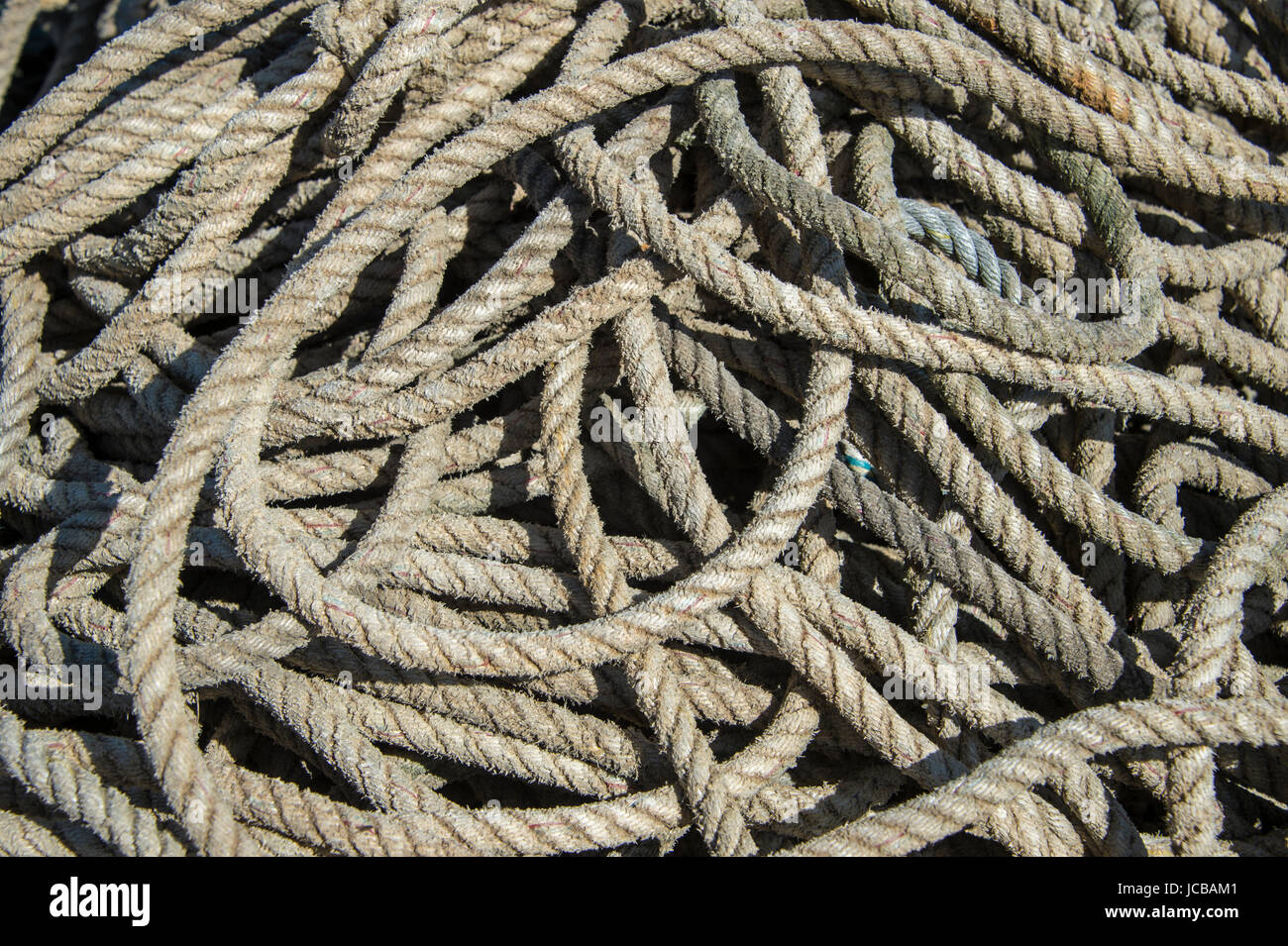 old rope in a pile Stock Photo - Alamy
