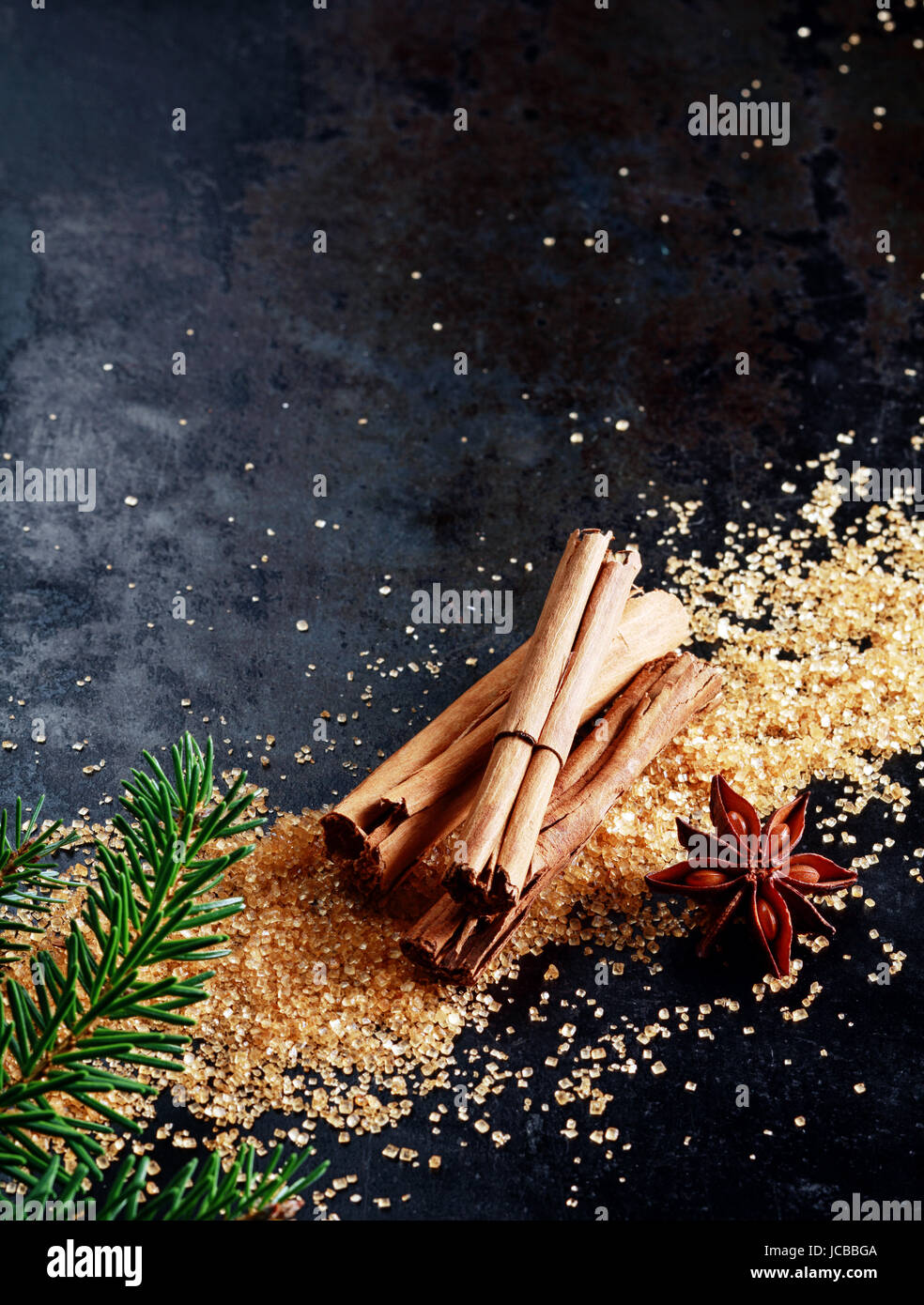 Christmas background with traditional spices with a bundle of stick ...