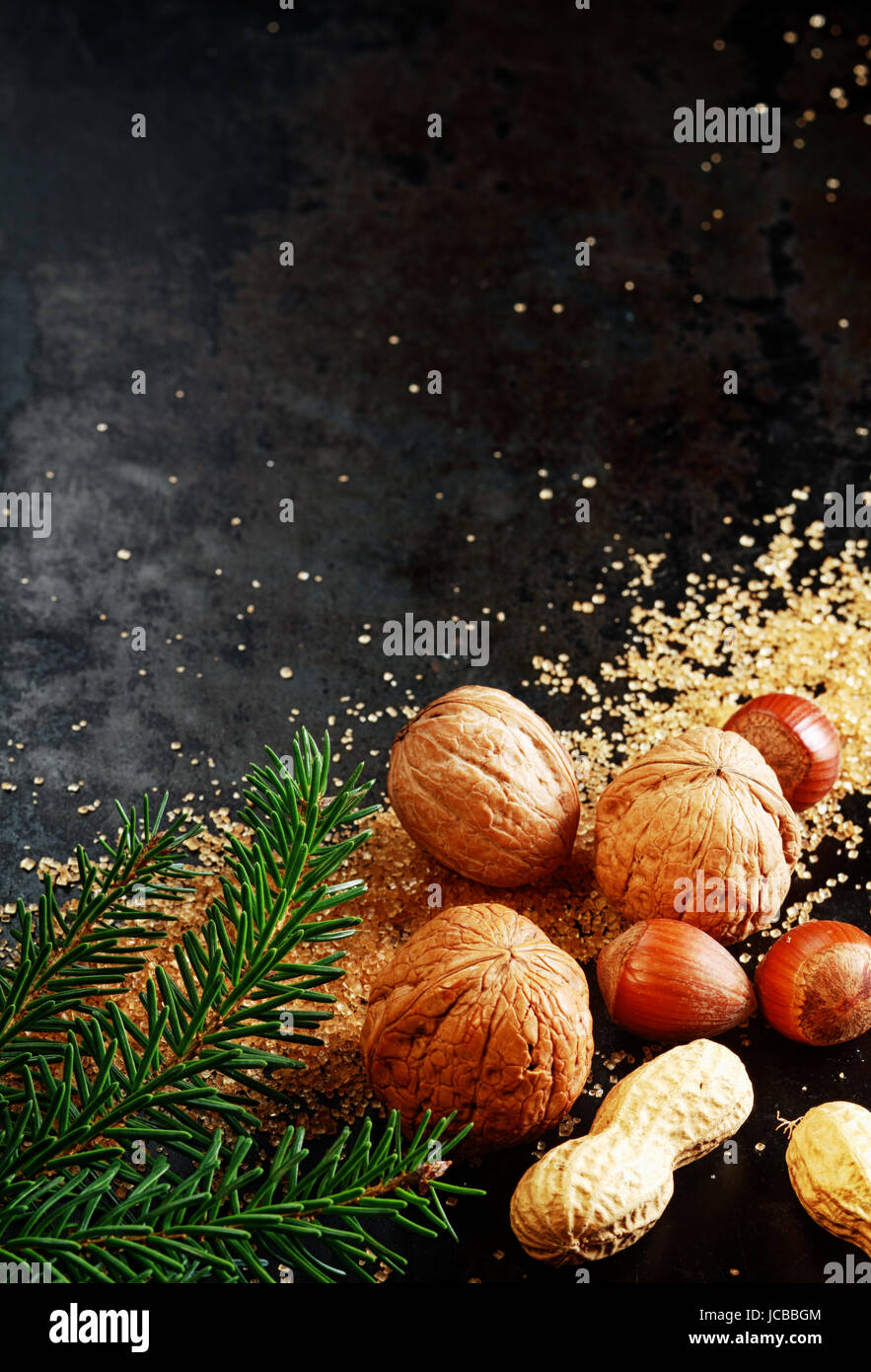 Traditional Christmas nuts with whole almonds, hazelnuts and peanuts in ...