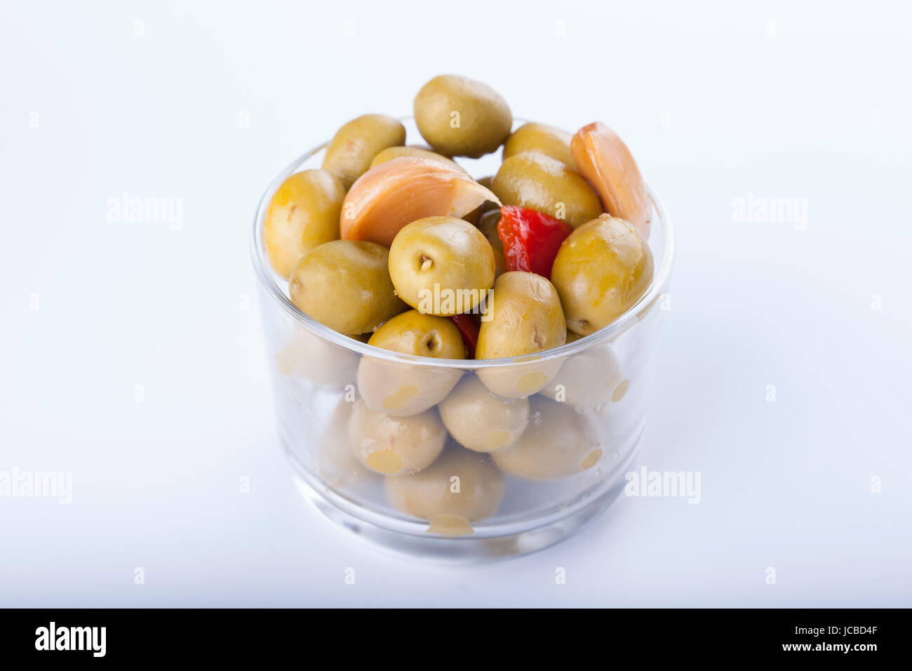 a handful of homemade olives on a glass, typical spanish tapa, isolated ...