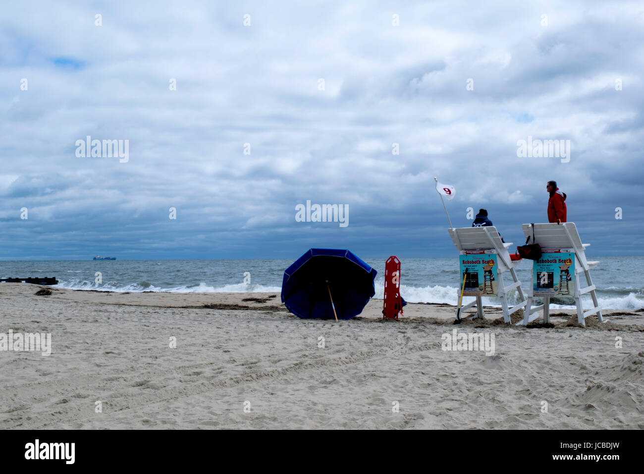 beach lifeguard at Rehoboth Beach, DE, on duty during stormy day with ...