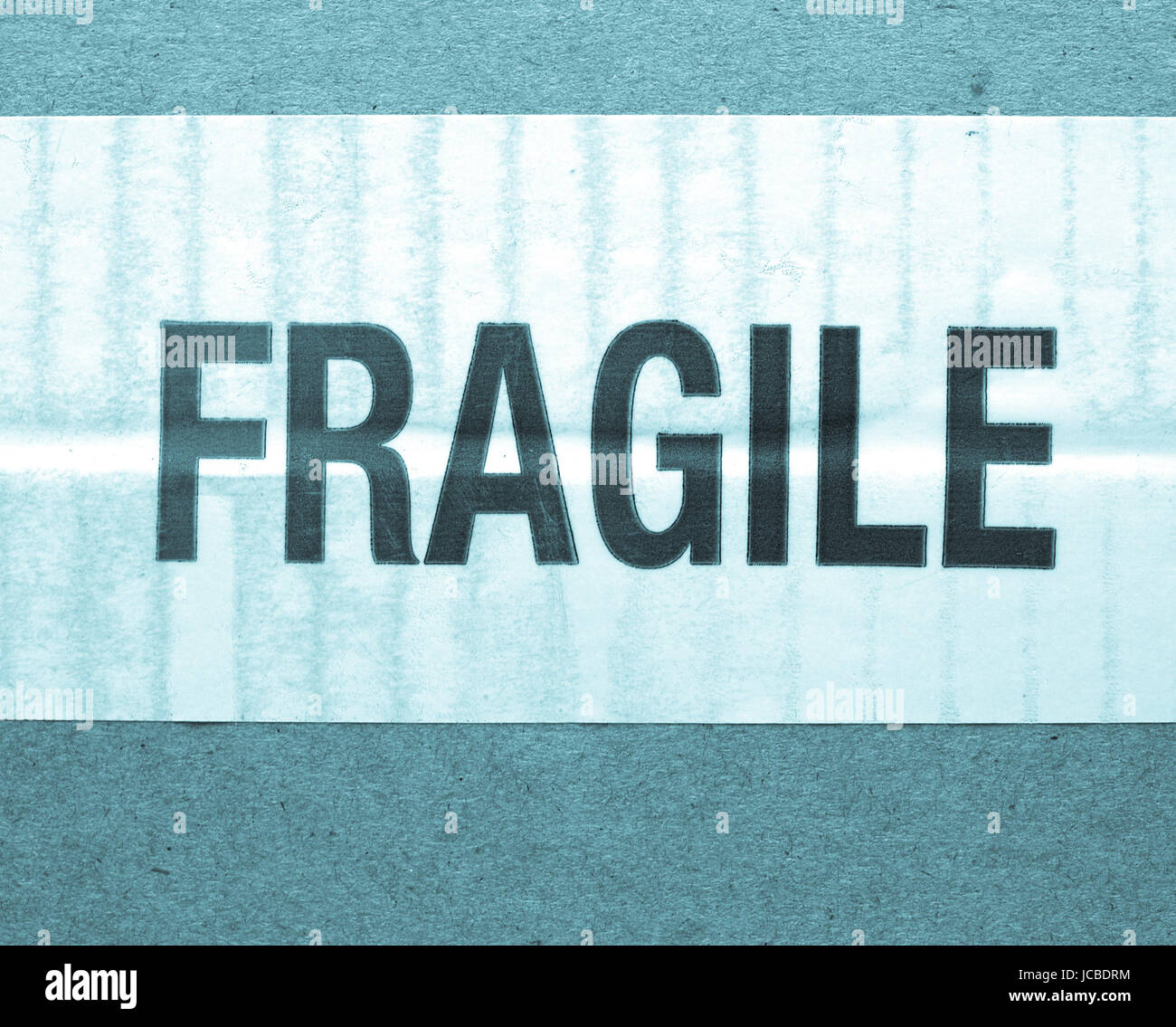 Detail of a fragile corrugated cardboard packet - cool cyanotype Stock Photo - Alamy