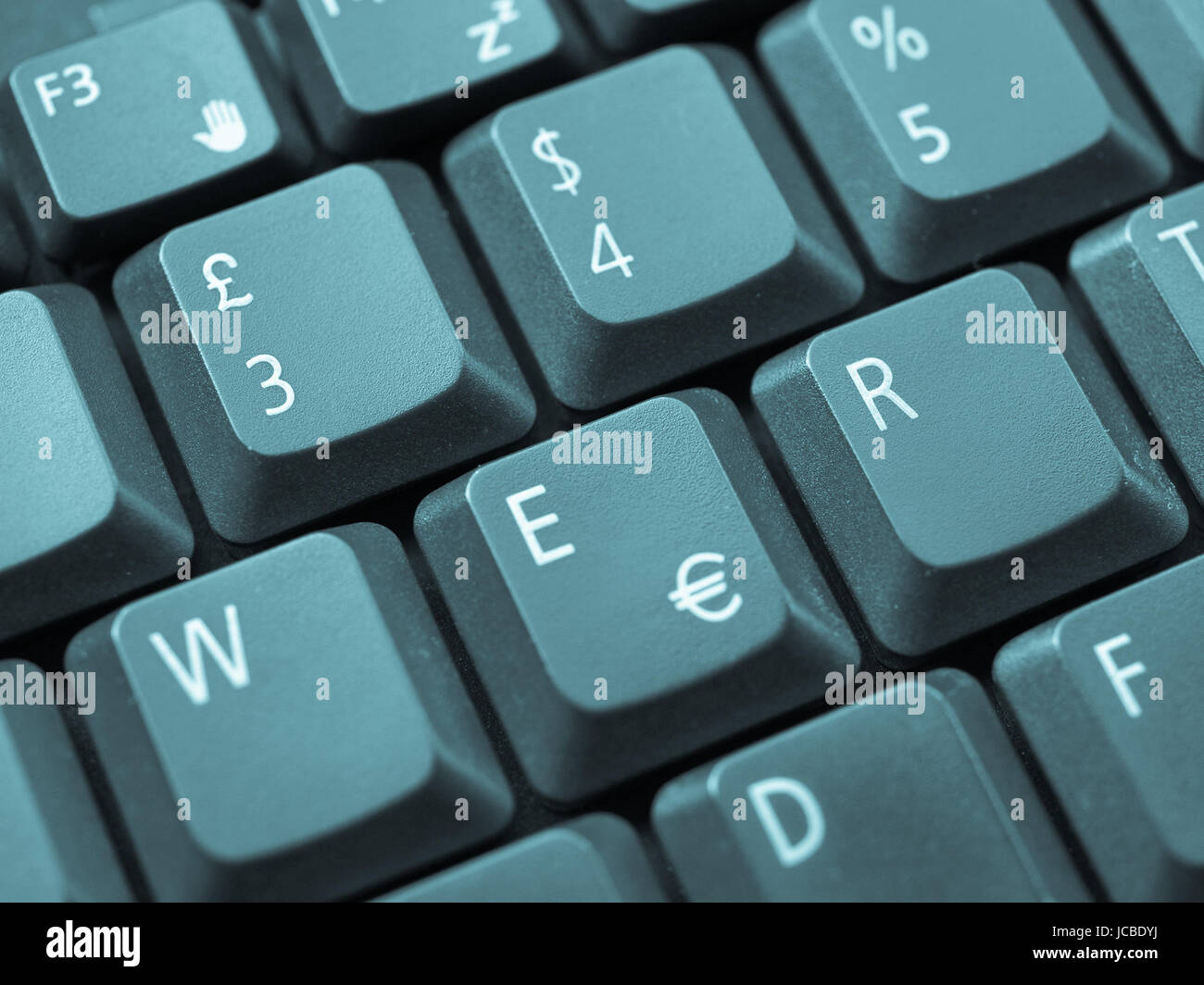 Detail of keys on a computer keyboard - cool cyanotype Stock Photo - Alamy