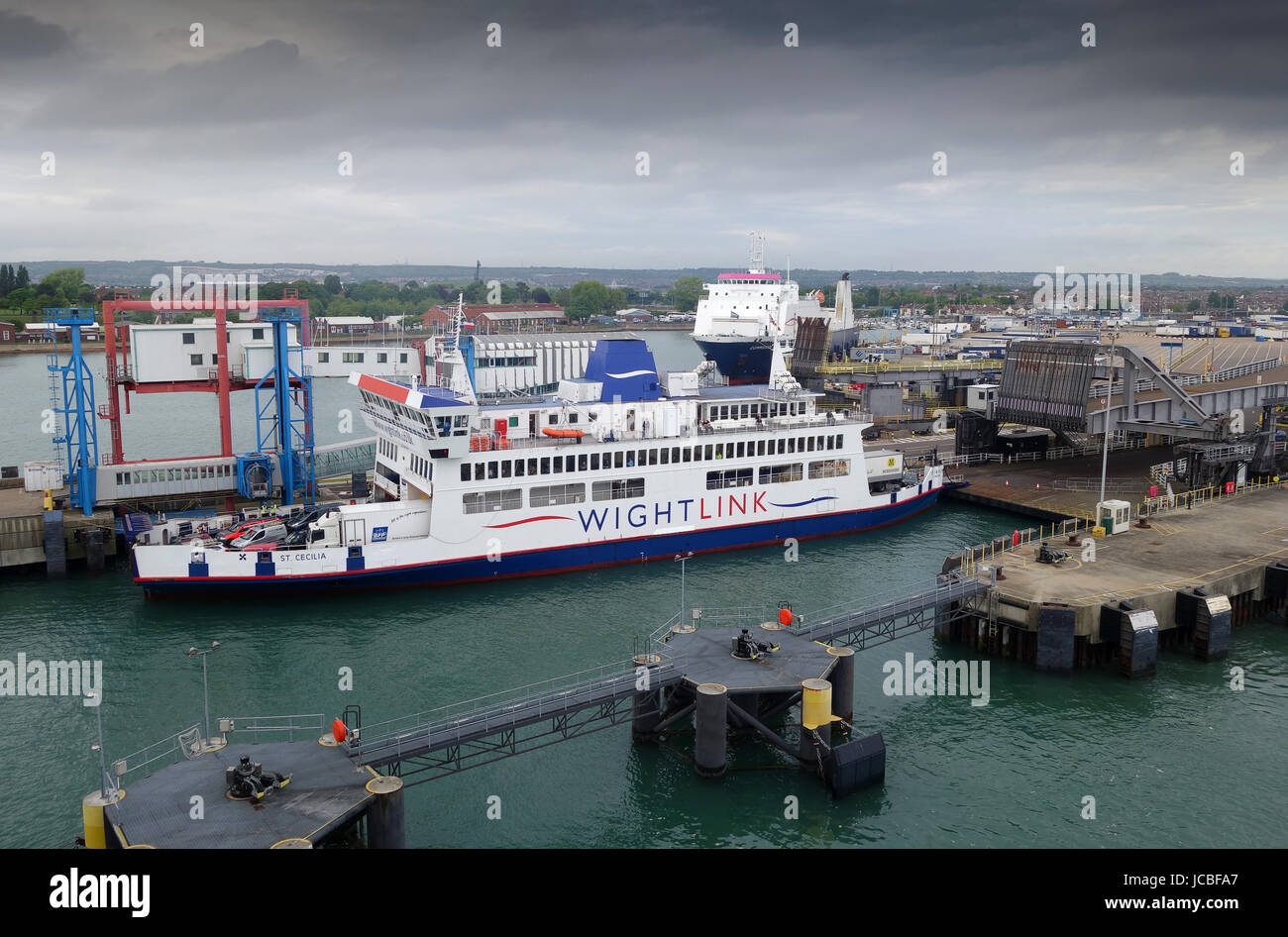 Wightlink ferry St Cecilia loading vehicles at Portsmouth harbour port ...