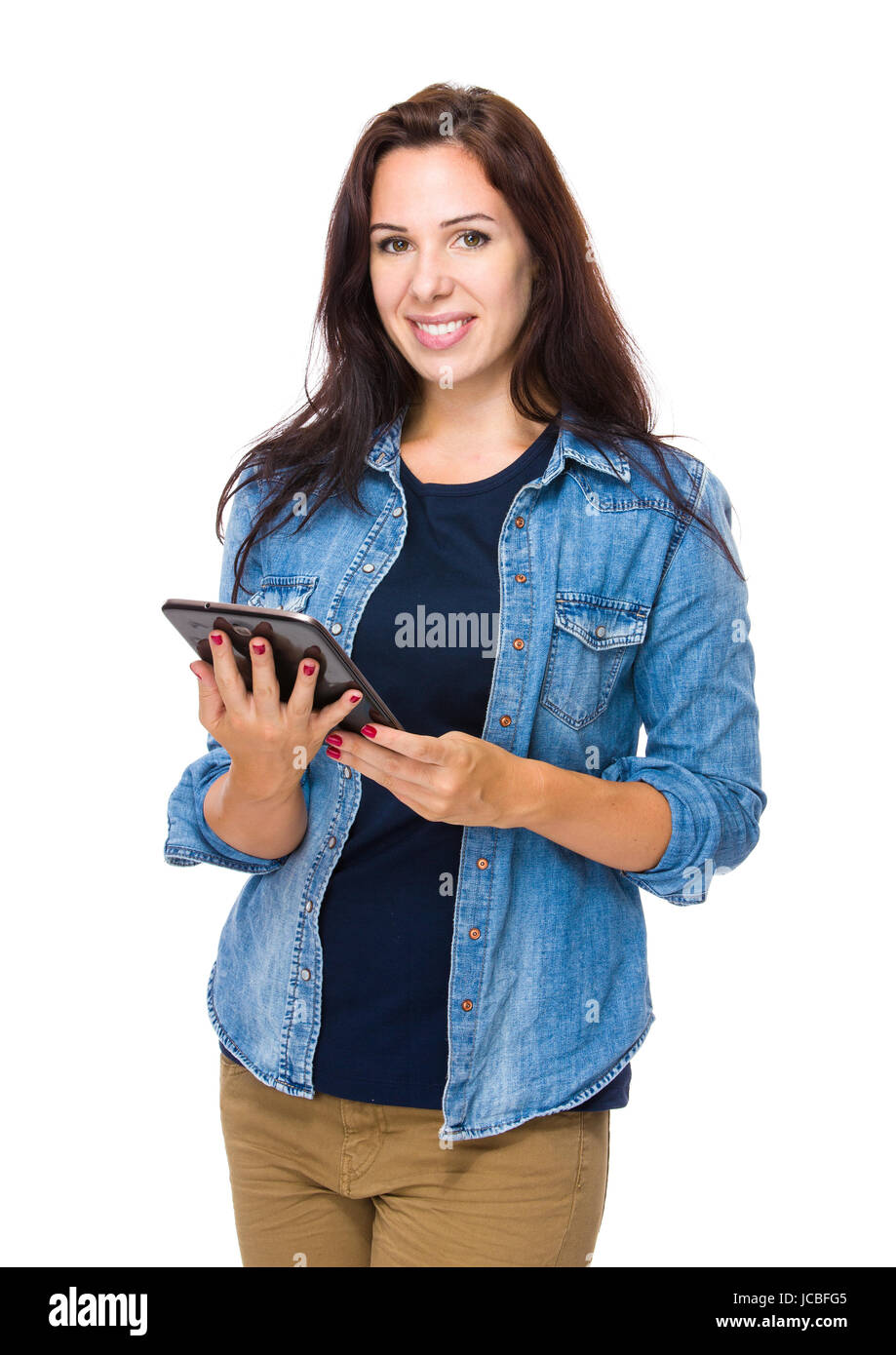 Brunette woman use of digital tablet Stock Photo - Alamy