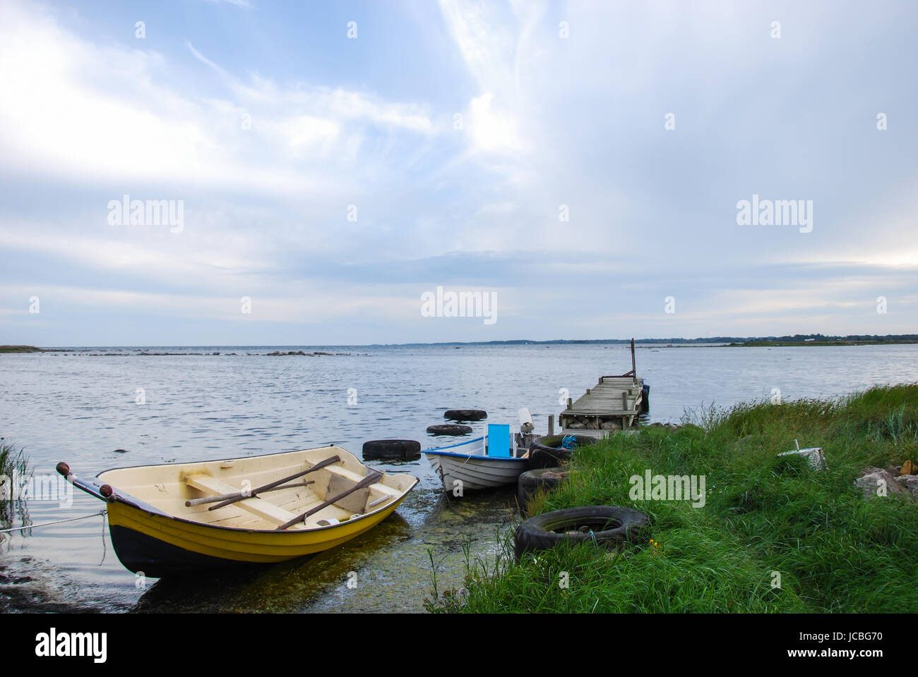 Moored rowing boats by the coast of Baltic Sea at the island Oland in ...