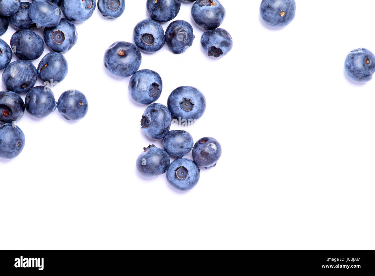 Some blueberries isolated on white Stock Photo - Alamy
