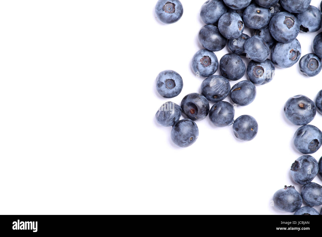 Some blueberries isolated on white Stock Photo - Alamy