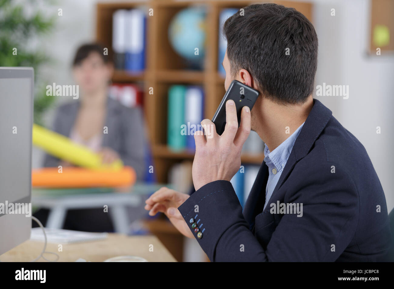 serious businessman is talking on mobile phone with managing director ...