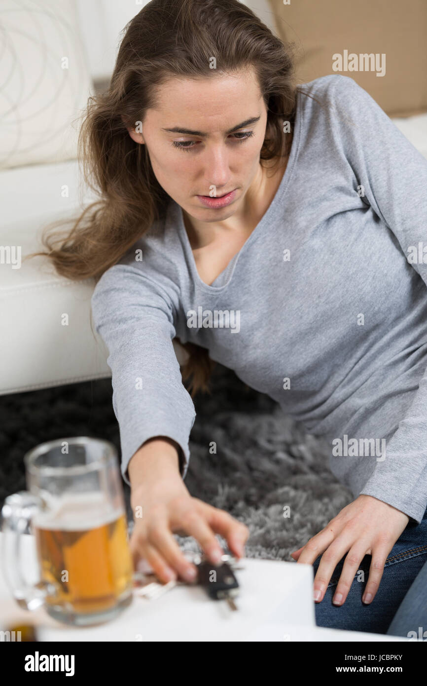 drunk woman holding keys Stock Photo - Alamy
