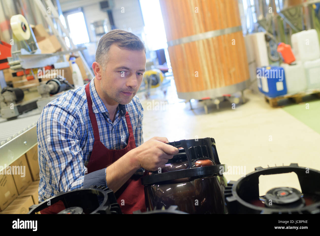 man filling canisters Stock Photo - Alamy